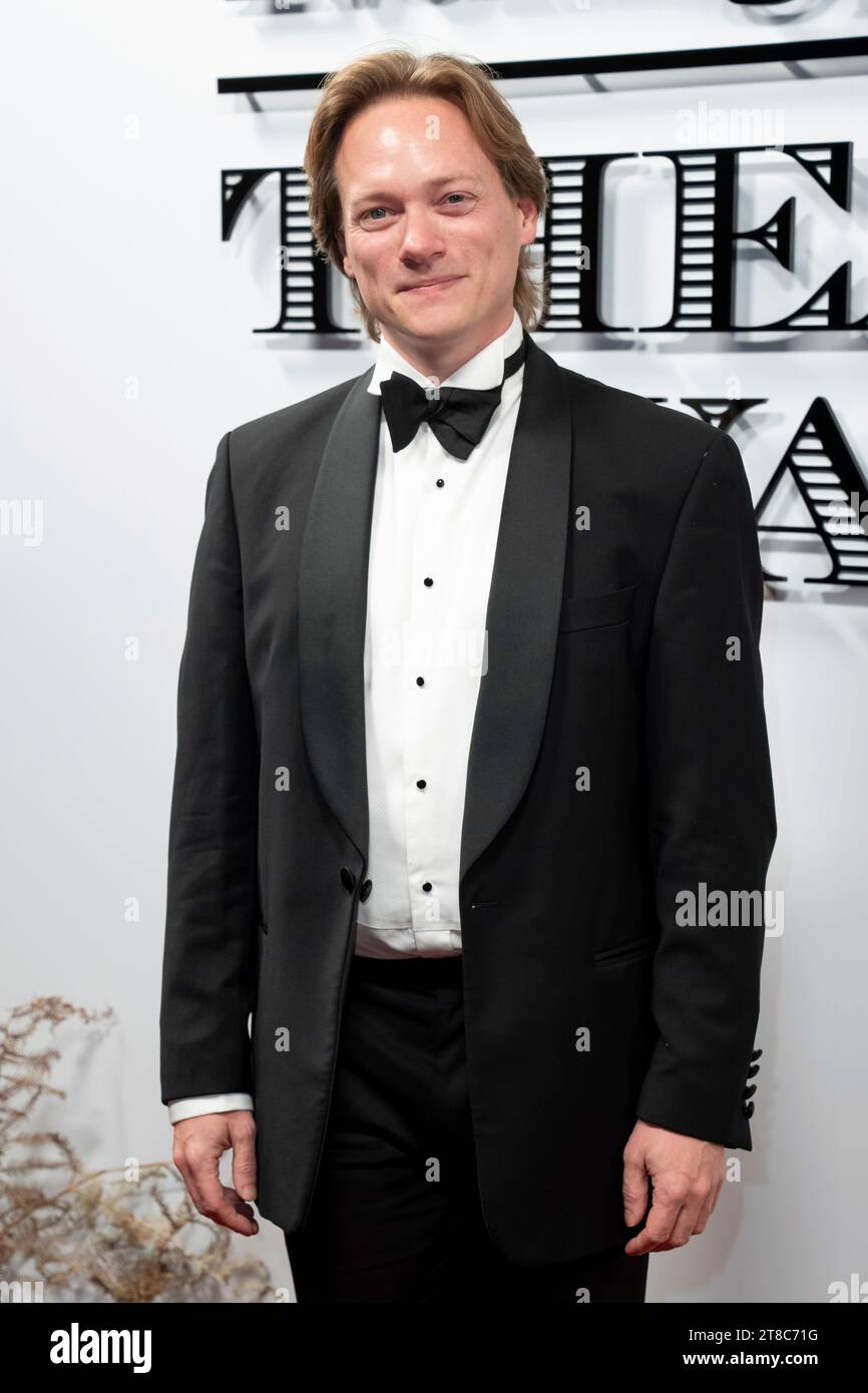 Tom Littler poses for photographers upon arrival at The Evening ...