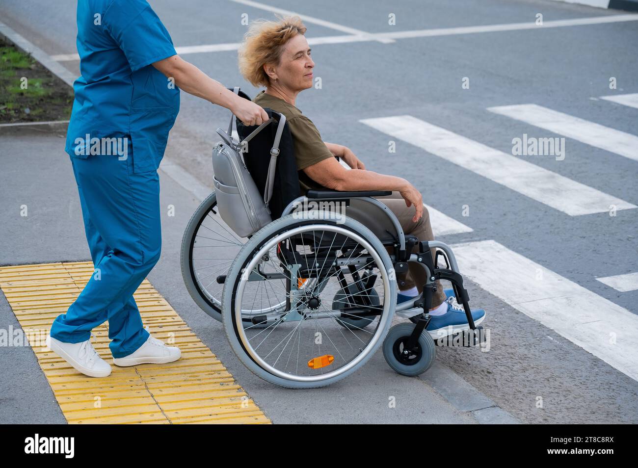 Helping old lady cross road hi-res stock photography and images - Alamy