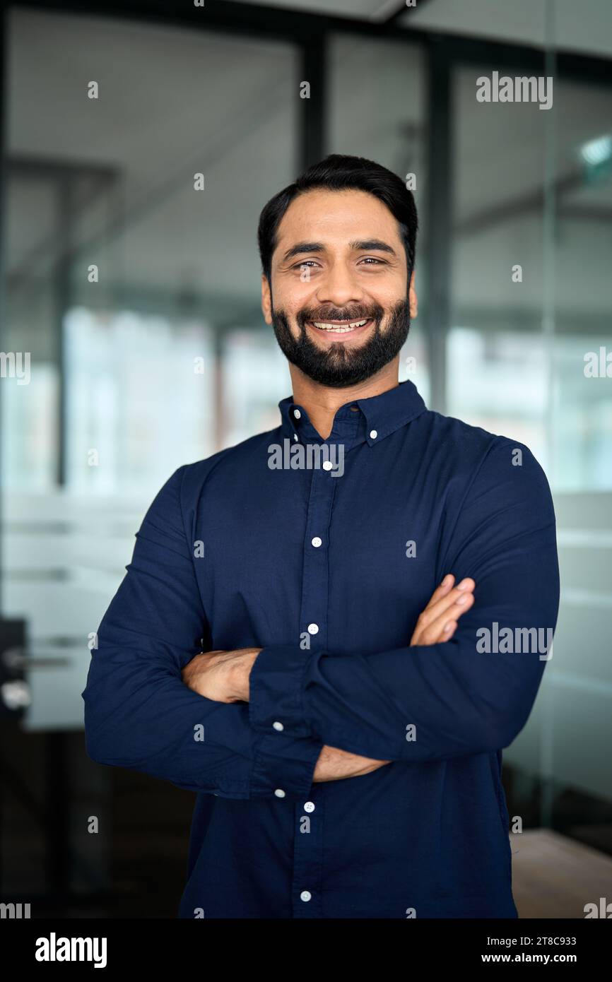 Happy Indian business man professional standing in office. Vertical ...