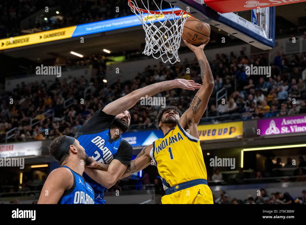 Orlando Magic center Goga Bitadze, center, attempts to block a shot by ...