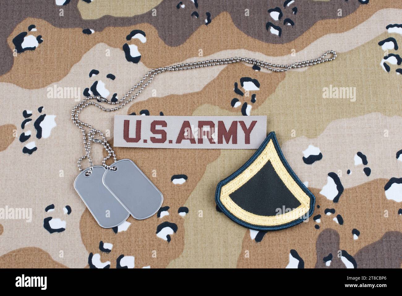 US ARMY Private First Class rank patch and dog tags on Desert Battle ...