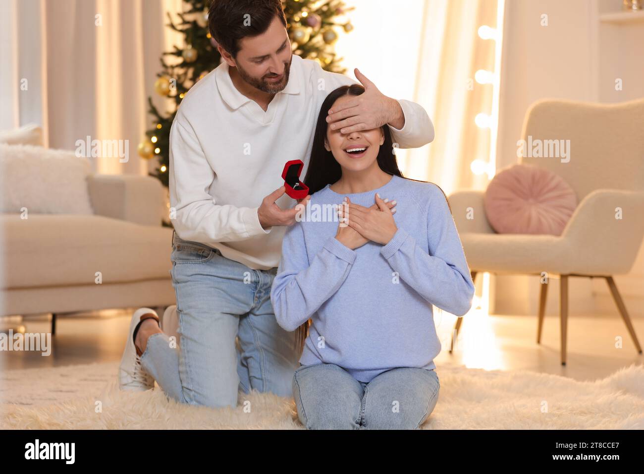 Making proposal. Man with engagement ring surprising his girlfriend at ...