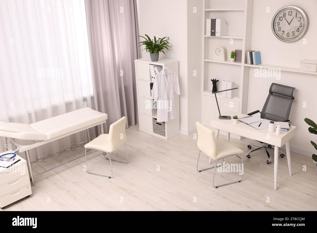 Modern medical office interior with doctor's workplace and examination ...