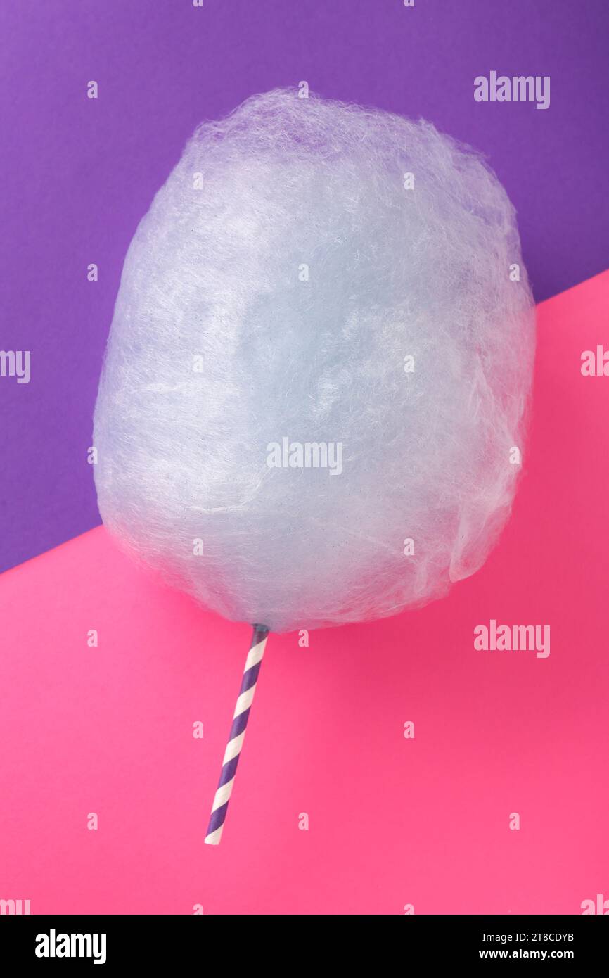 Sweet light blue cotton candy on color background, top view Stock Photo ...