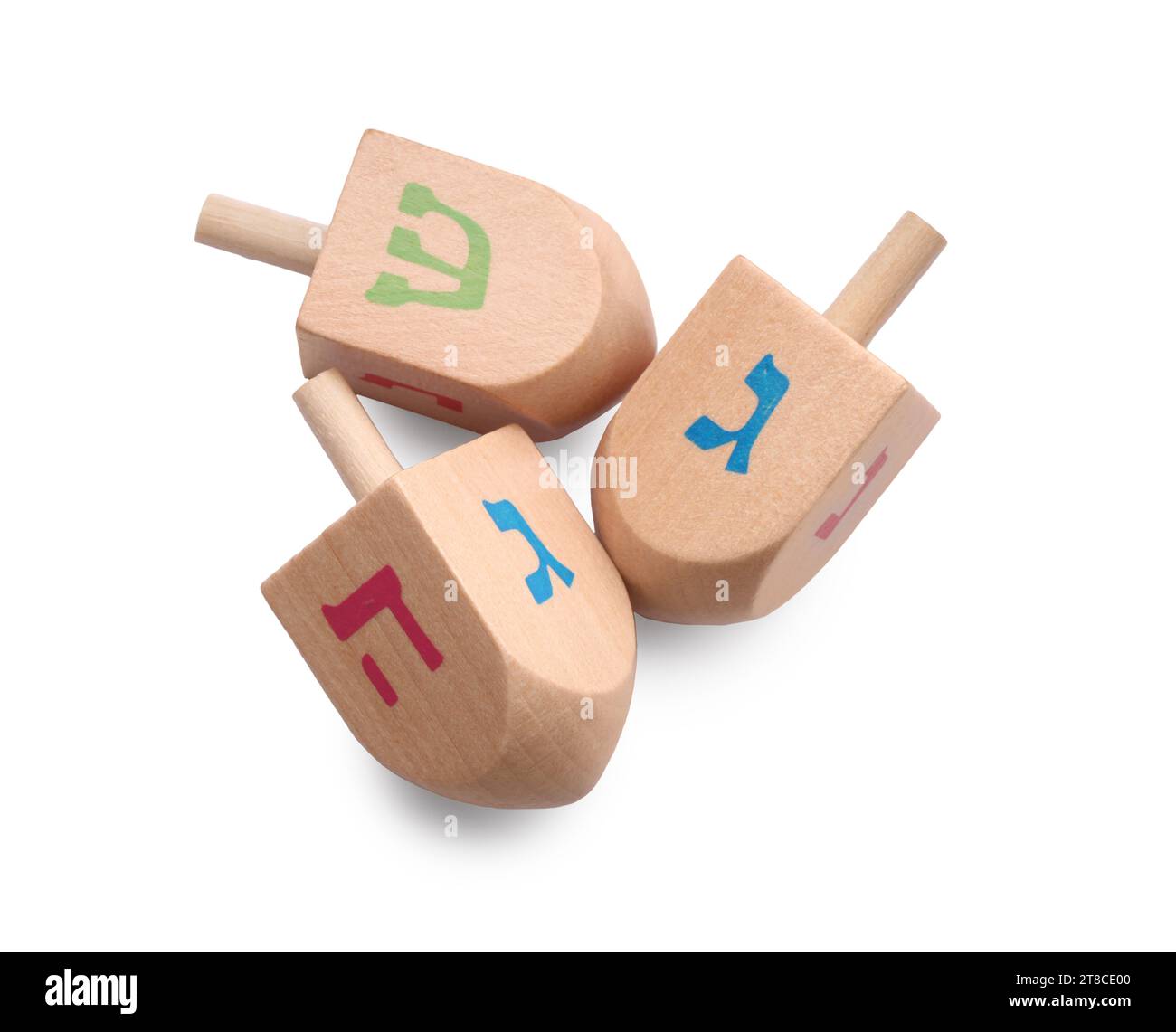 Wooden dreidels isolated on white, top view. Traditional Hanukkah game ...
