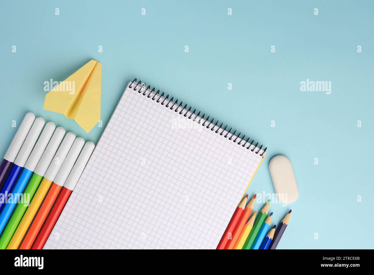 Flat lay composition with open notebook and other school stationery on ...