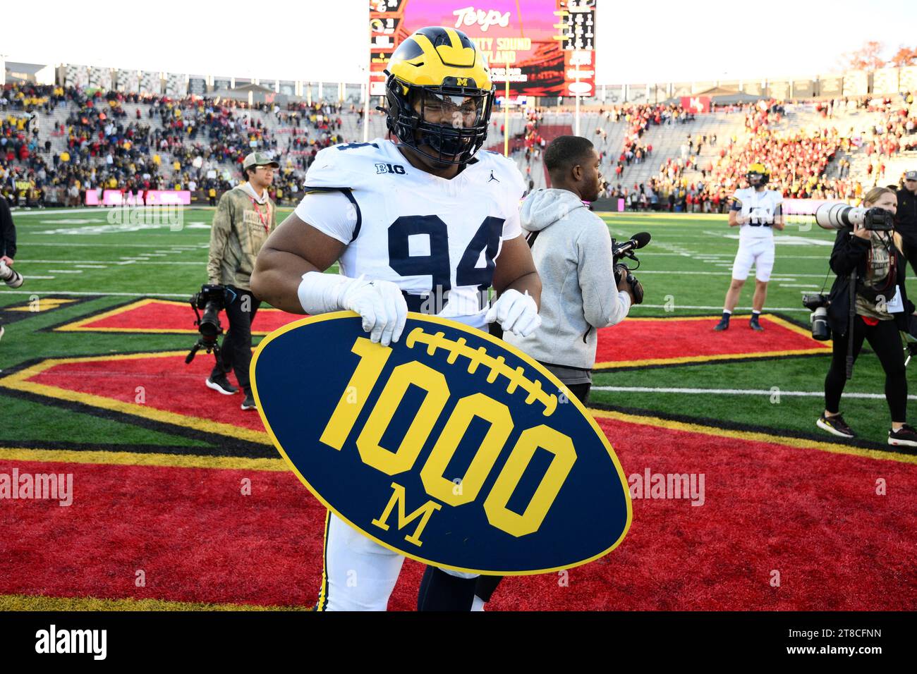 Michigan defensive lineman Kris Jenkins (94) holds up a 1,000 sign ...