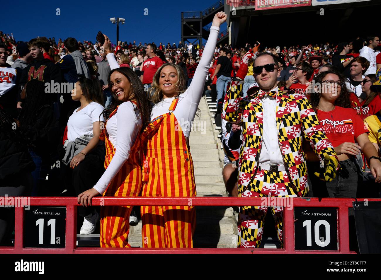 Spectators react during the first half of an NCAA college football game ...