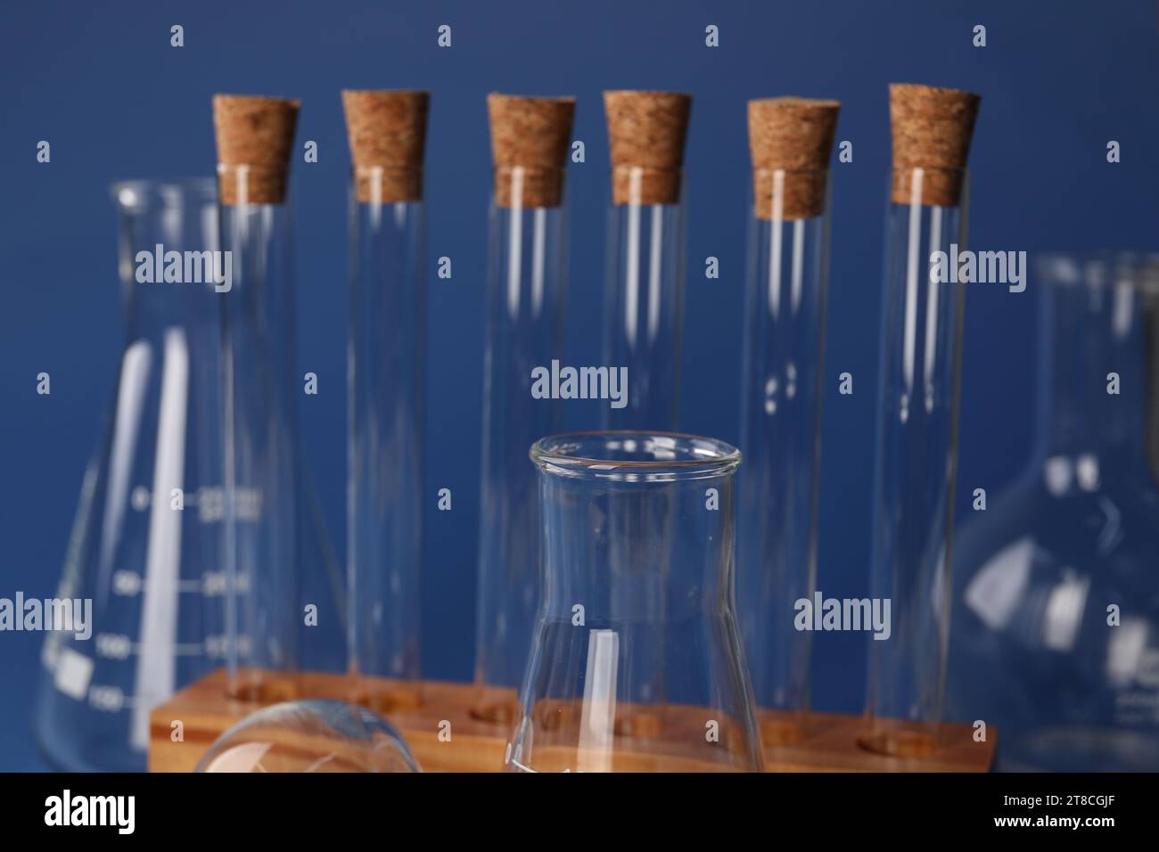 Different laboratory glassware on blue background, closeup Stock Photo ...