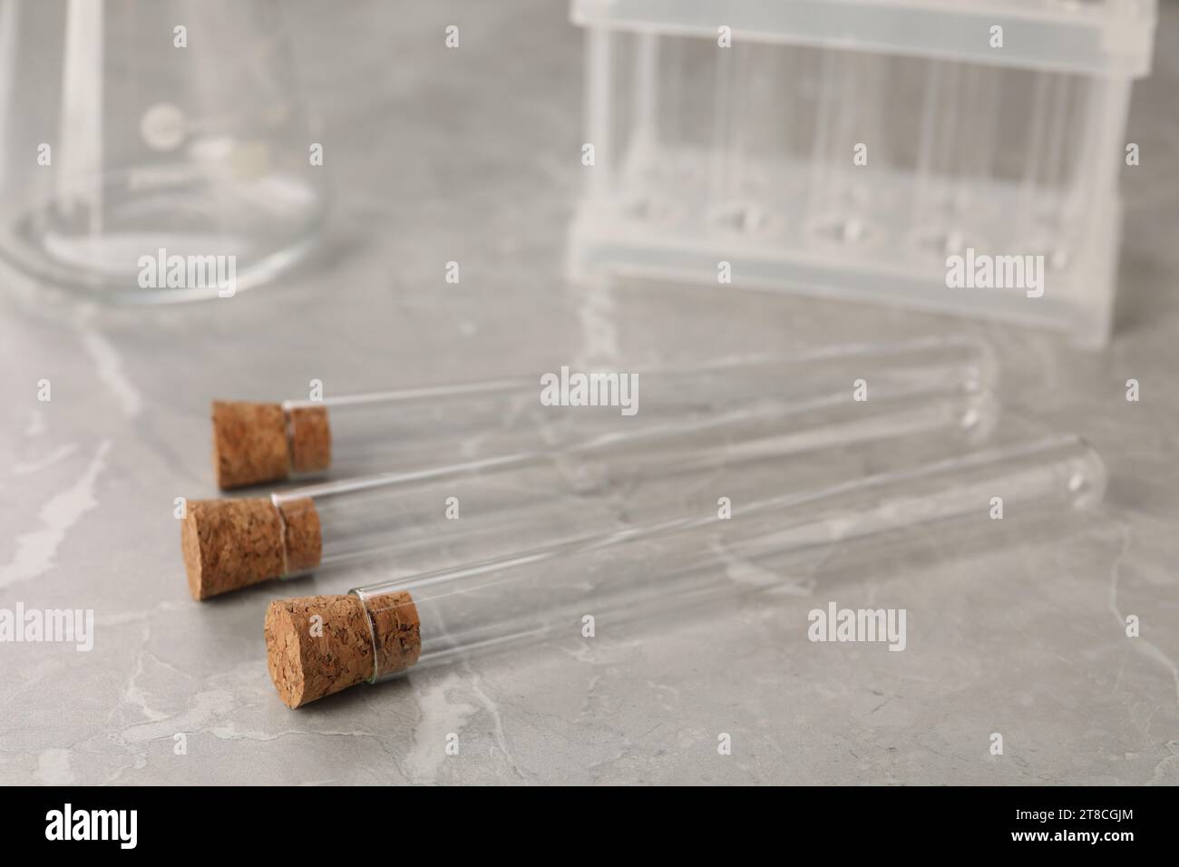Test tubes on grey marble table, closeup. Laboratory glassware Stock ...