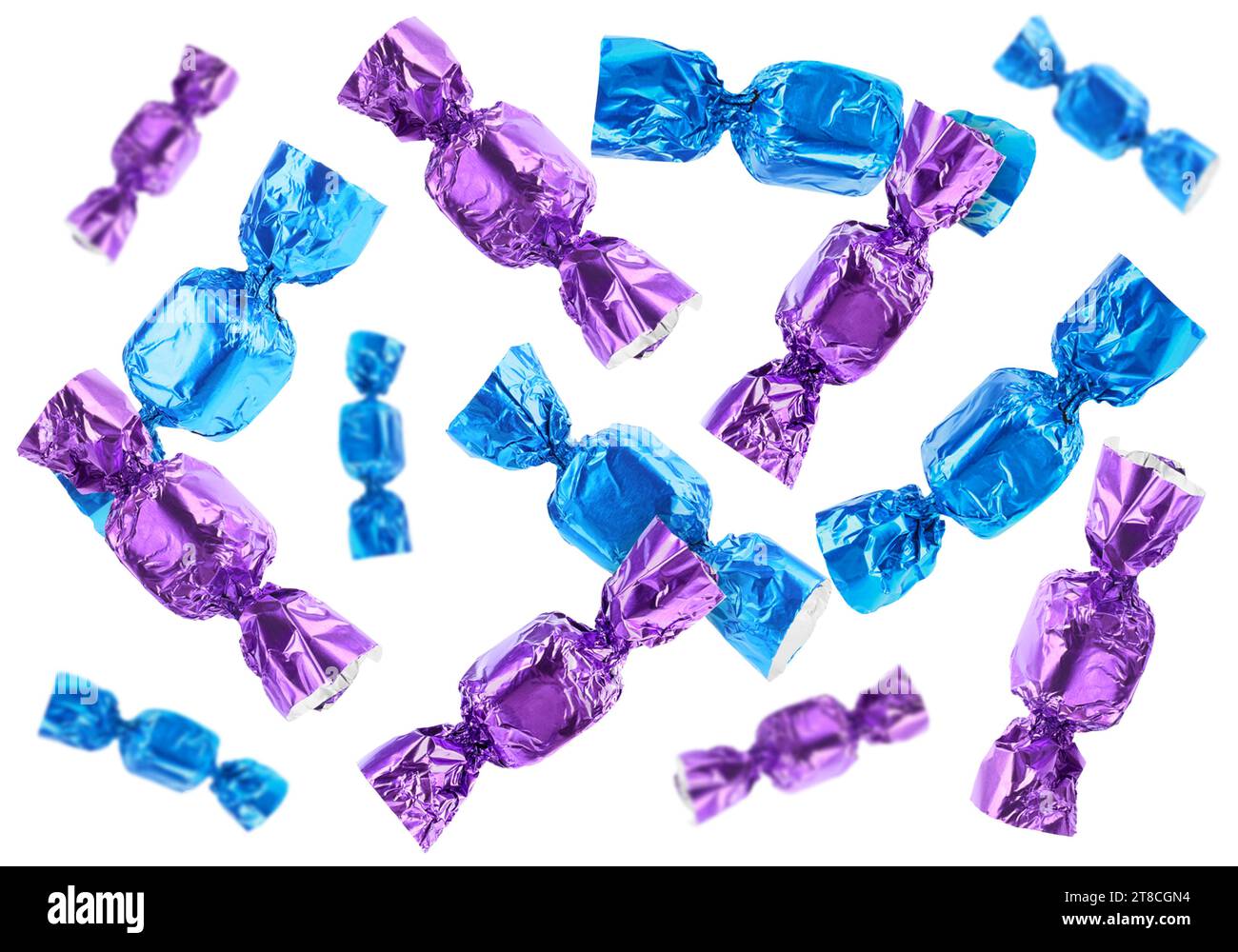 Tasty candies in bright wrappers falling on white background Stock ...