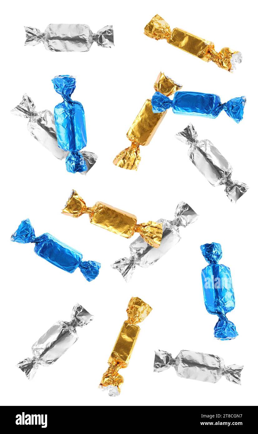 Tasty candies in bright wrappers falling on white background Stock ...