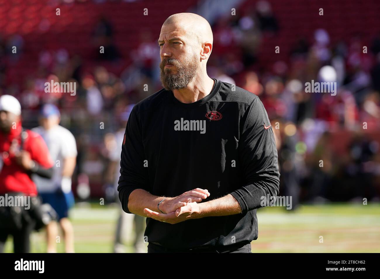 San Francisco 49ers assistant coach Brian Fleury watches players warm ...