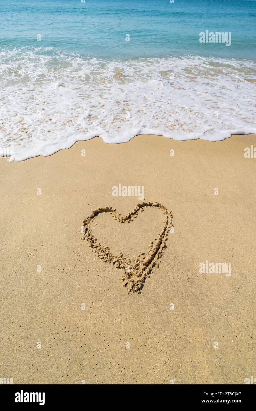 heart drawn in the sand on the beach. Romantic design element Stock ...