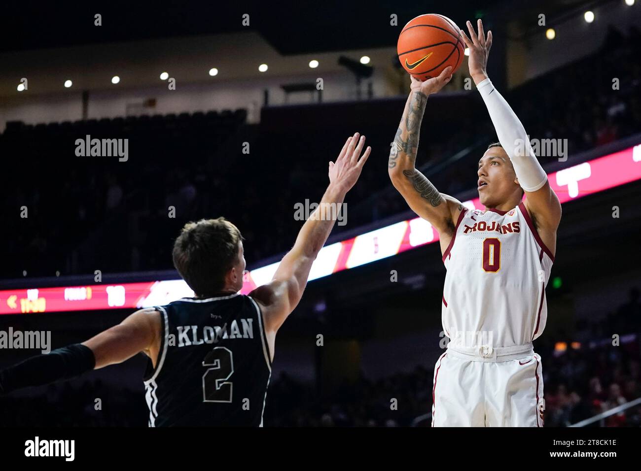 Southern California guard Kobe Johnson shoots against Brown guard Felix ...
