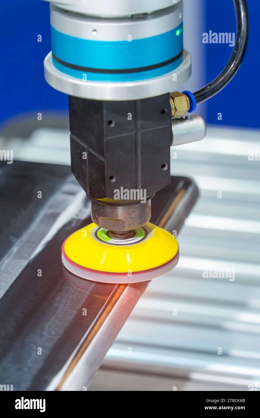 robot arm polishing the mobile phone part in the production line Stock ...