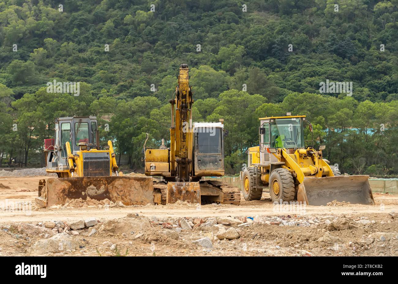 excavator loader machine and Heavy earth mover during earthmoving works ...