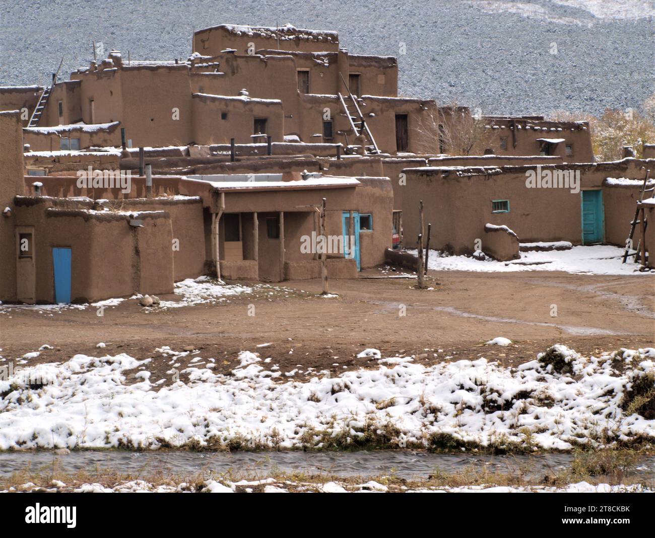Taos Pueblo adobe dwelling and snow Stock Photo - Alamy