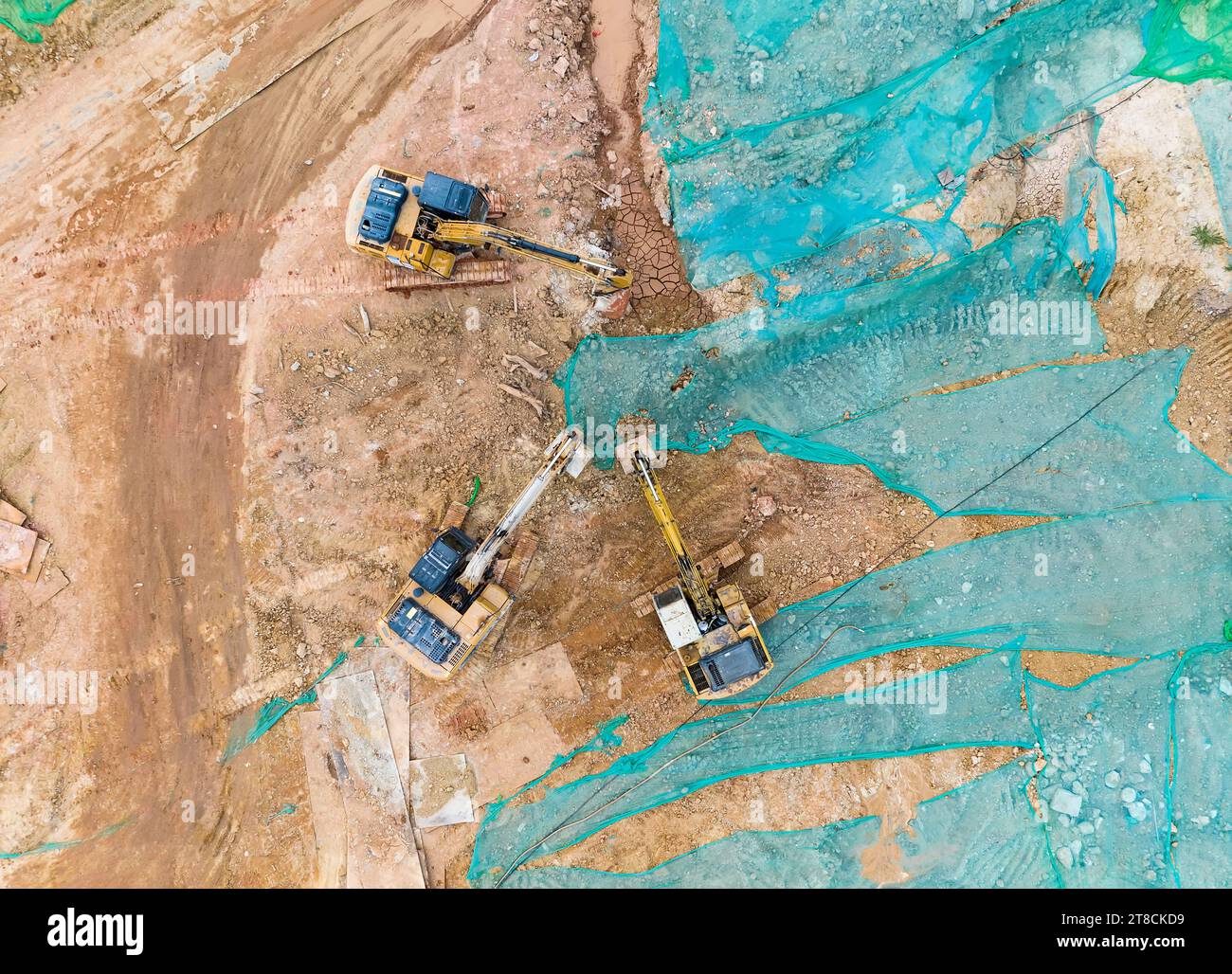 Excavator on earthmoving at construction site, aerial view Stock Photo ...