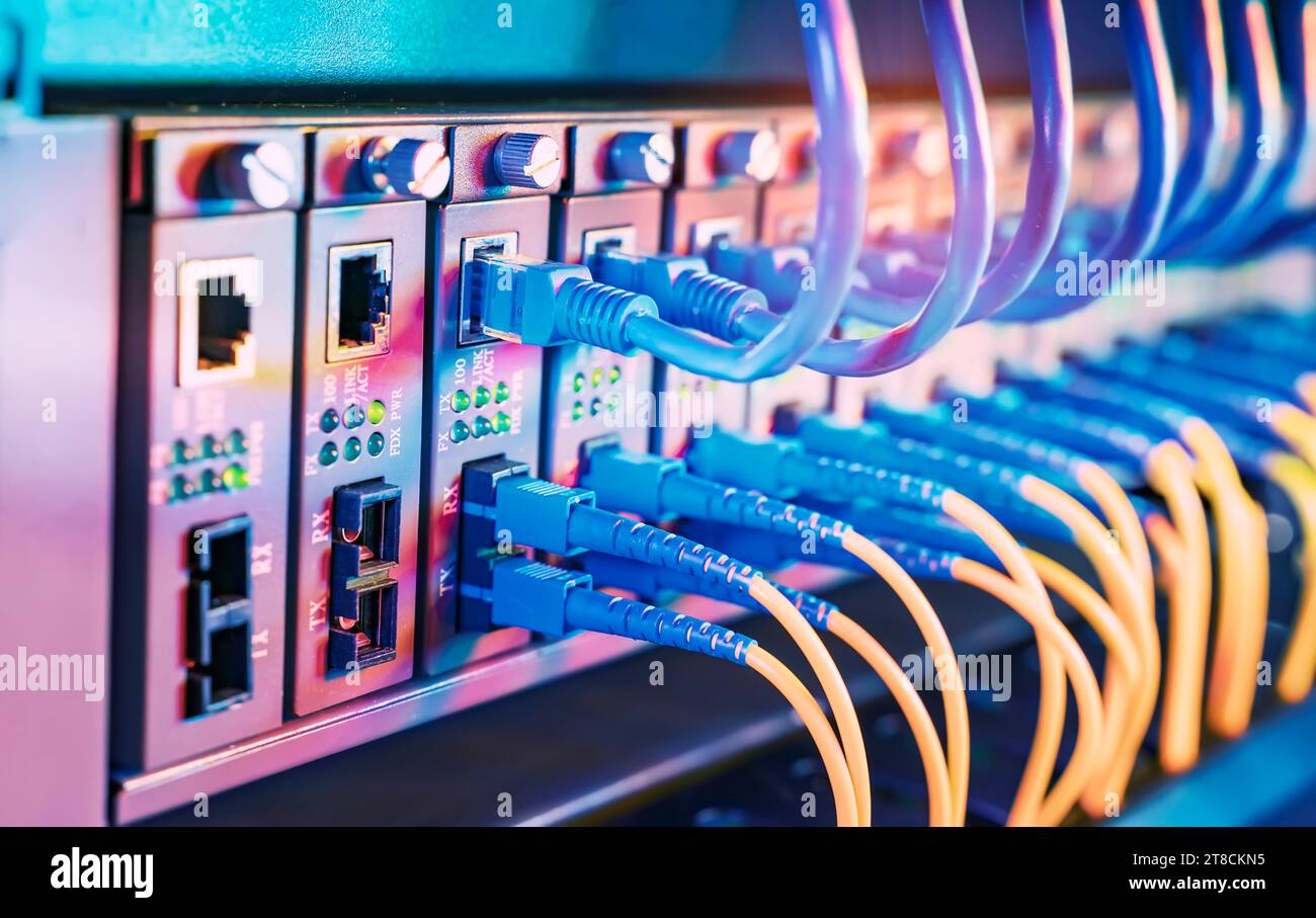 Fiber Optical cables connected to an optic ports and Network cables ...