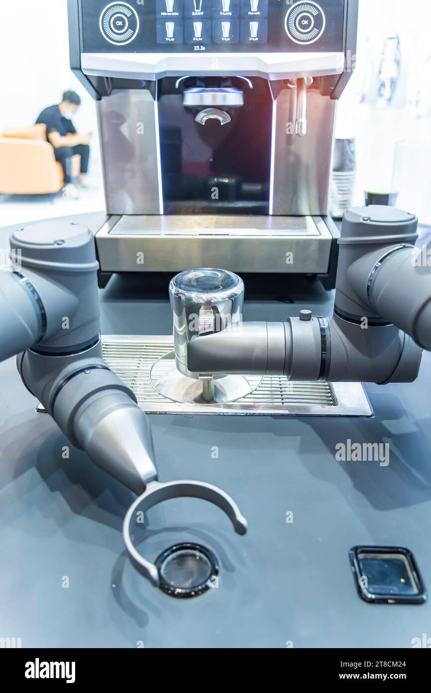 automatic robot arm preparing coffee with coffee machine Stock Photo ...