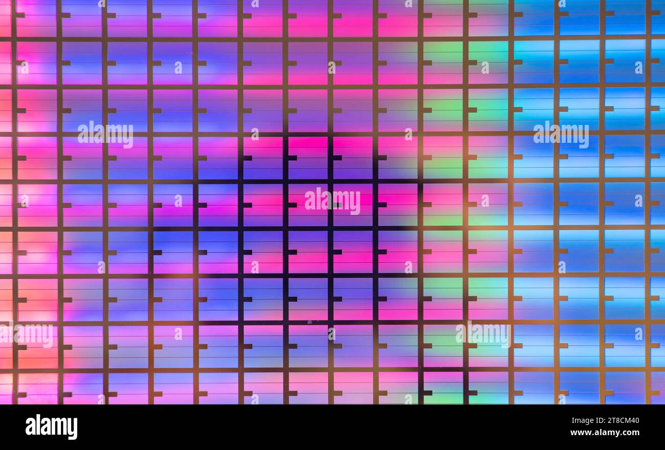 silicon wafer with microchips reflecting different colors Stock Photo ...