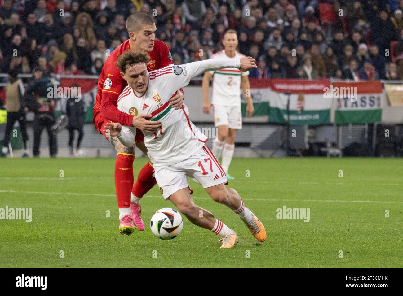 Budapest. 19th Nov, 2023. Slobodan Rubezic (L) of Montenegro vies with ...