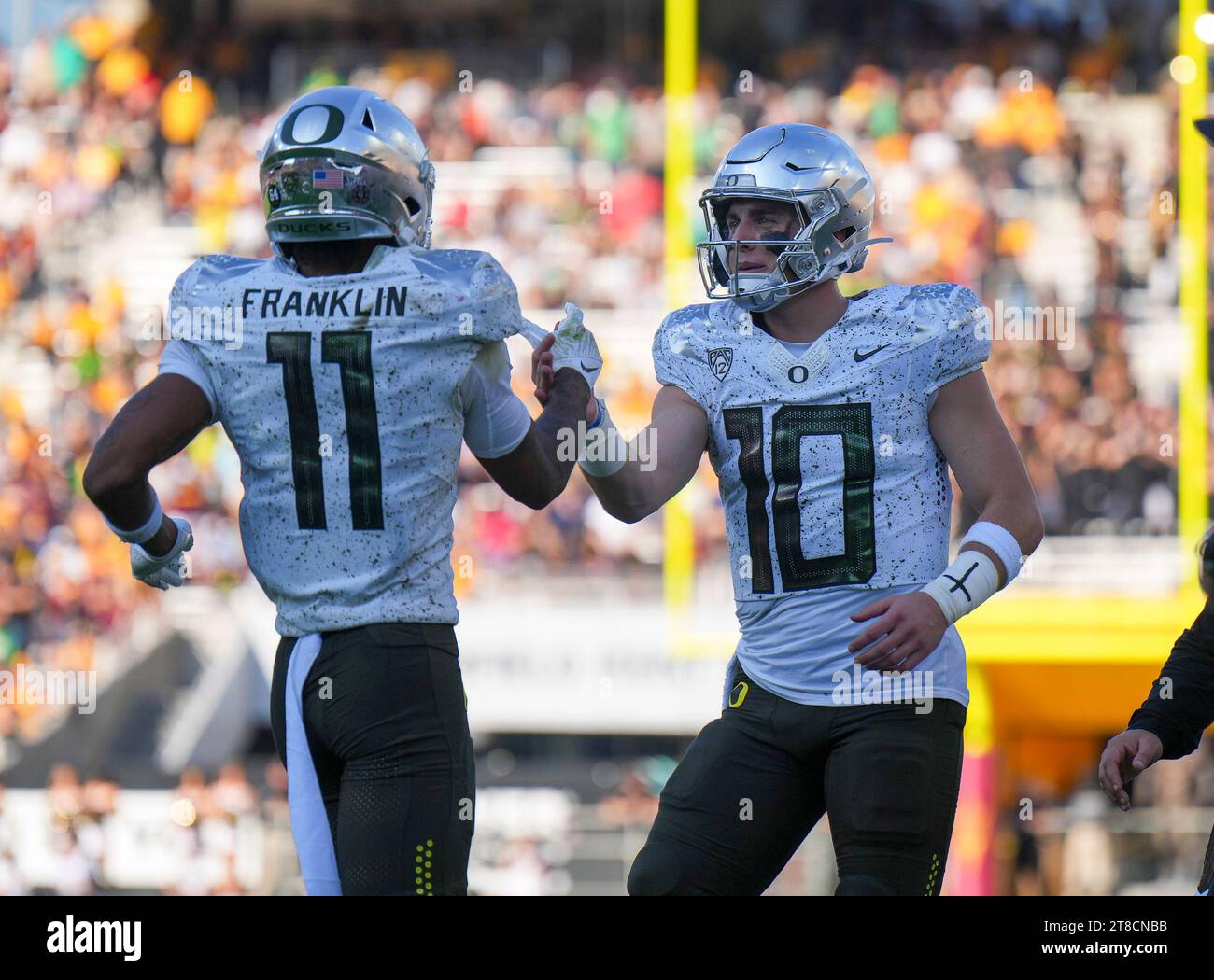 Gilbert, Arizona, USA. 18th Nov, 2023. Troy Franklin (11) and Bo Nix ...