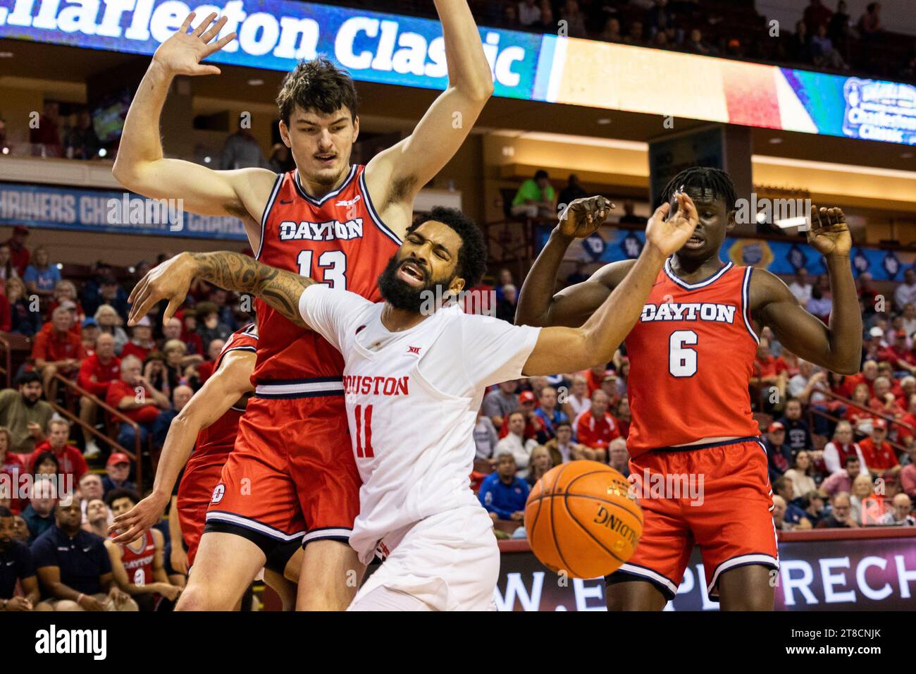 Houston's Damian Dunn (11) loses control of the ball against Dayton's ...