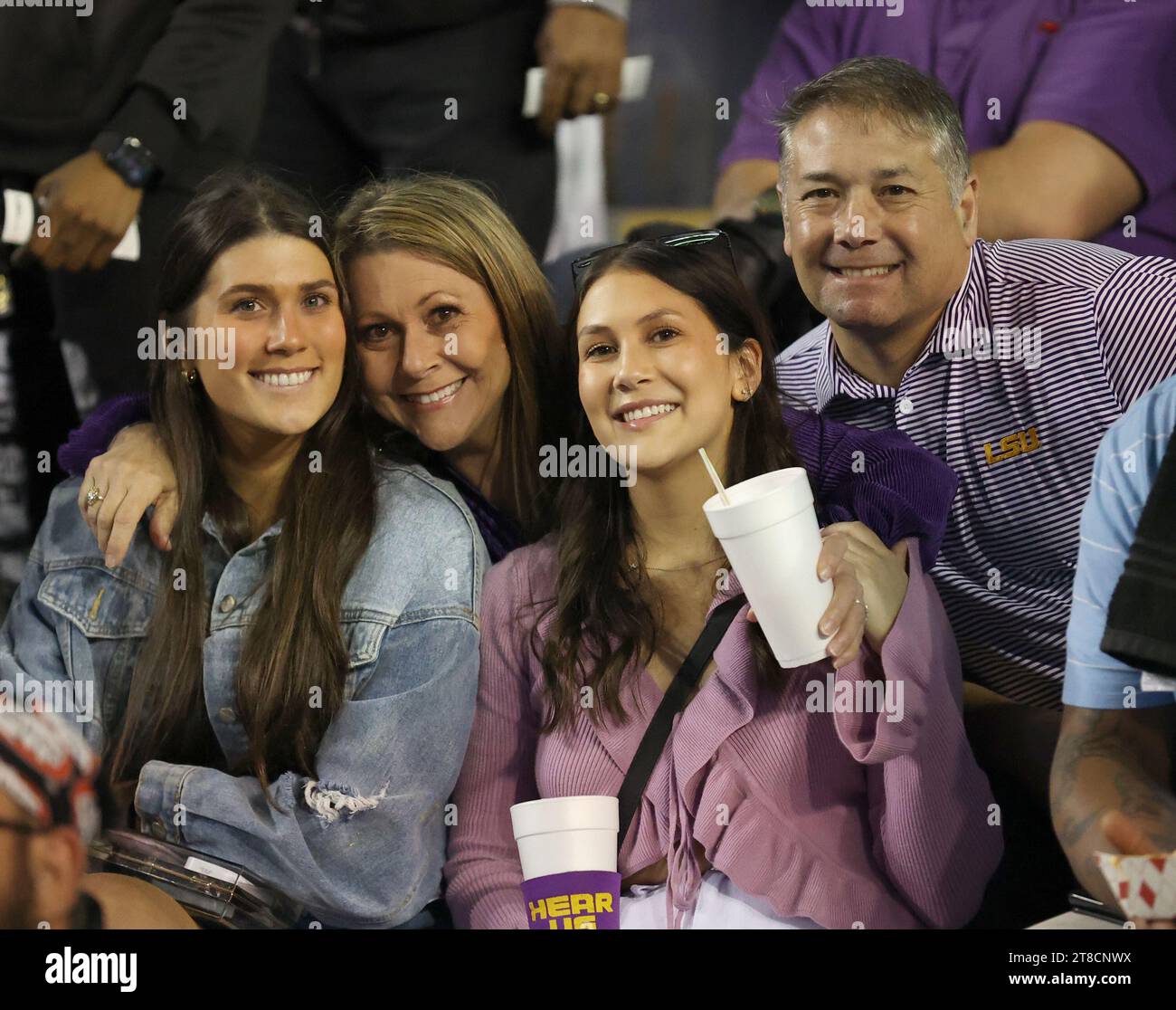 Baton Rouge, USA. 19th Nov, 2023. A group of LSU Tigers fans pose for a photo during a college ...