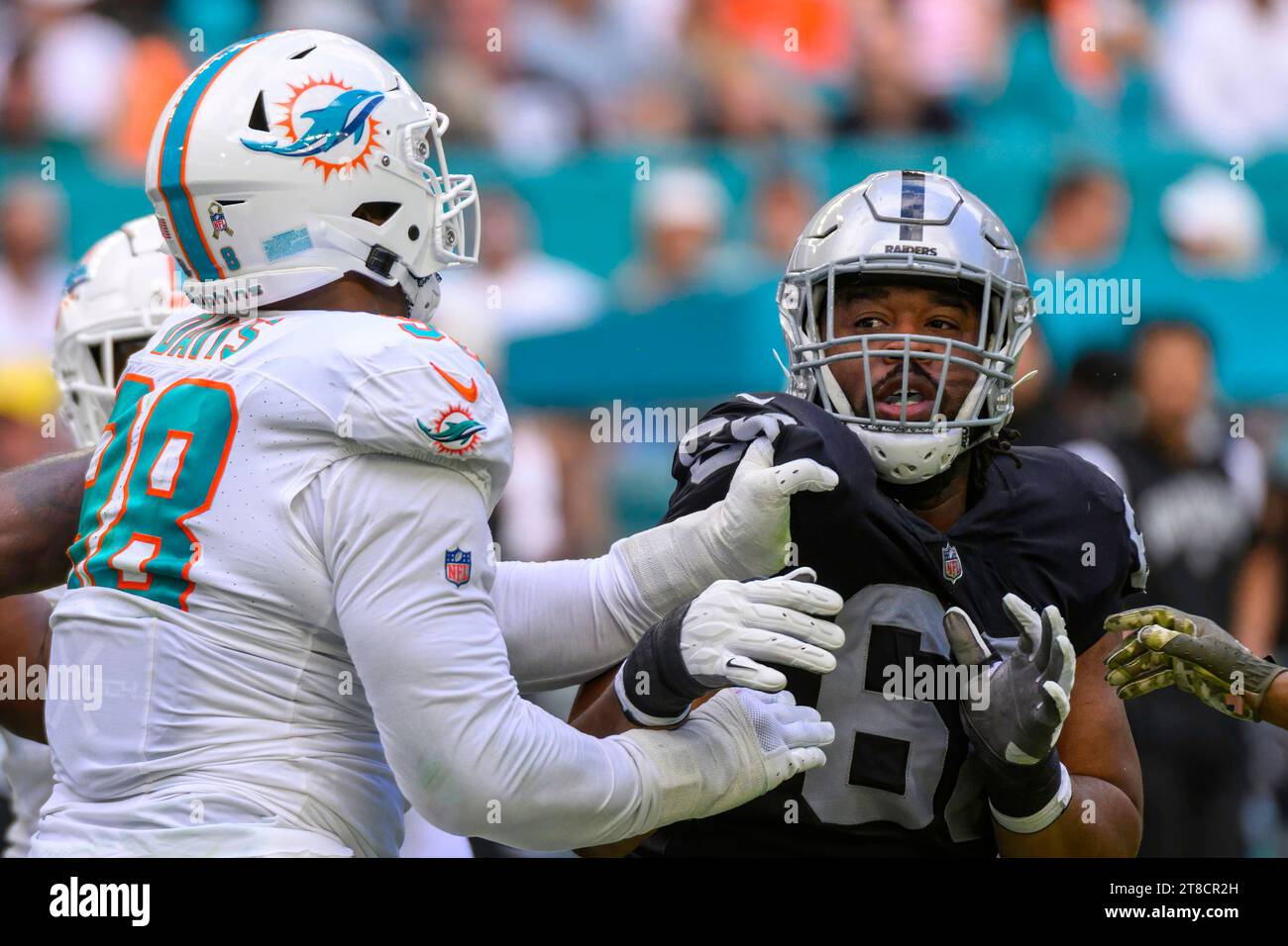 Miami Dolphins defensive tackle Raekwon Davis (98) and Las Vegas ...