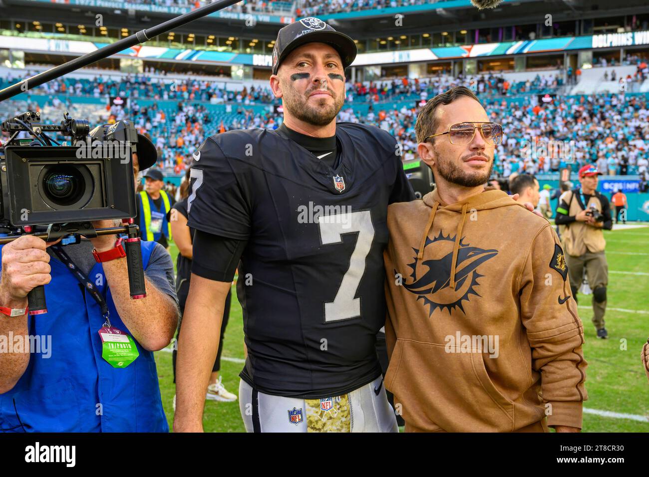 Las Vegas Raiders quarterback Brian Hoyer (7) and Miami Dolphins head ...