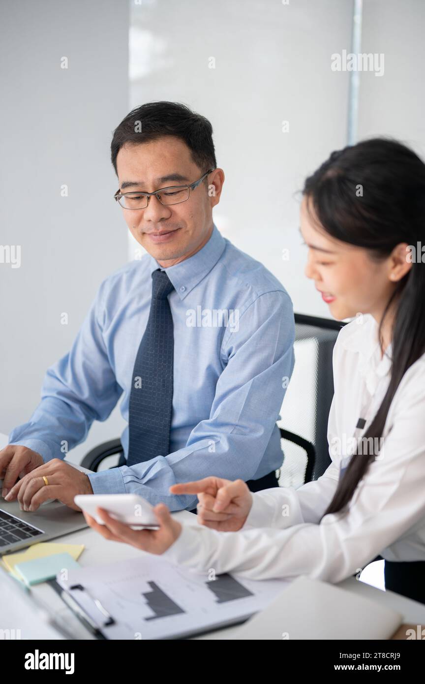 Young motivated businesswoman working with experience senior ...