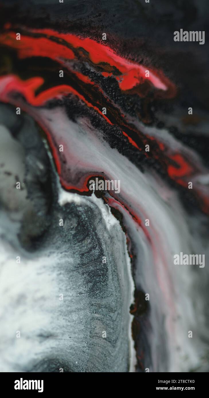 Ink wave glitter fluid paint water flow red black Stock Photo - Alamy