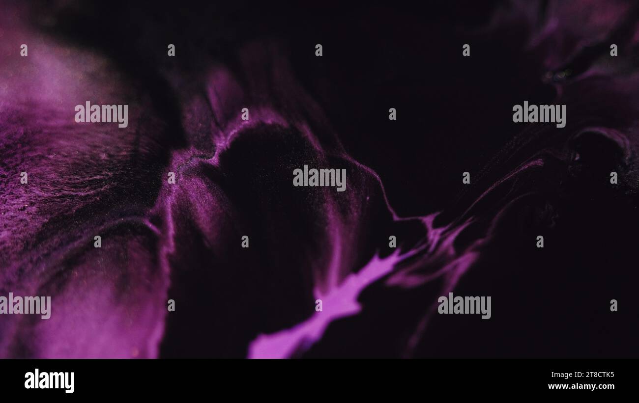 Ink fluid glitter water defocused hi-res stock photography and images ...