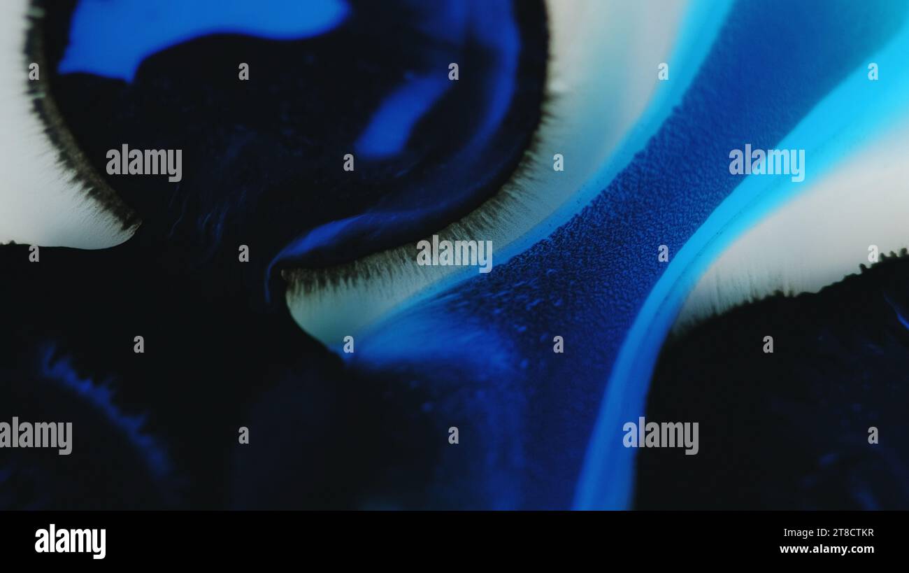 Paint flow ink blend wave blue black fluid mix Stock Photo - Alamy