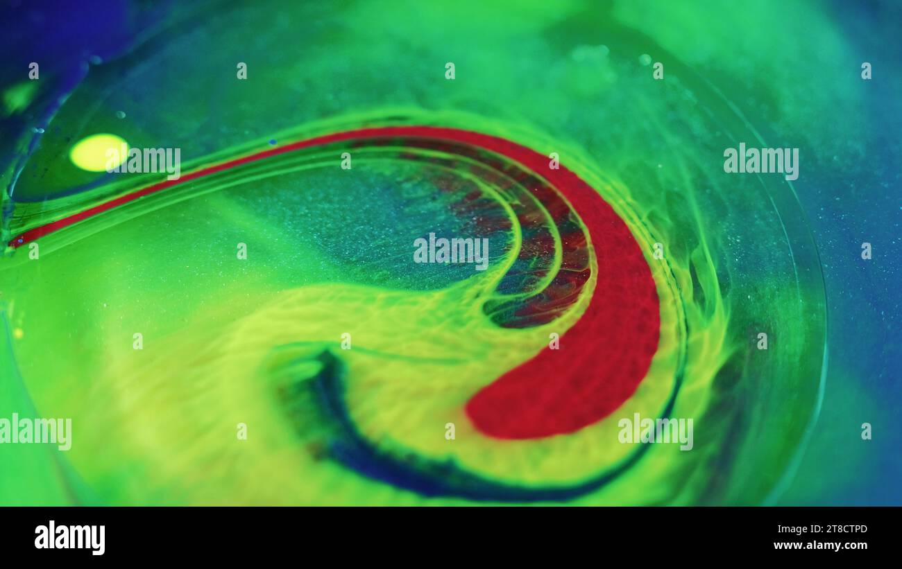 Liquid dye background shimmering swirls oil drop Stock Photo - Alamy