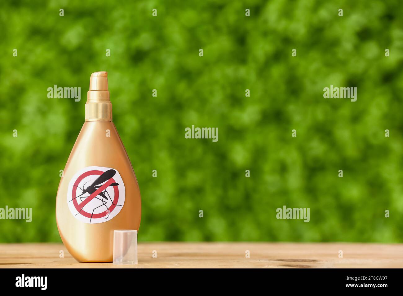 Spray bottle of mosquito repellent on table outdoors Stock Photo - Alamy