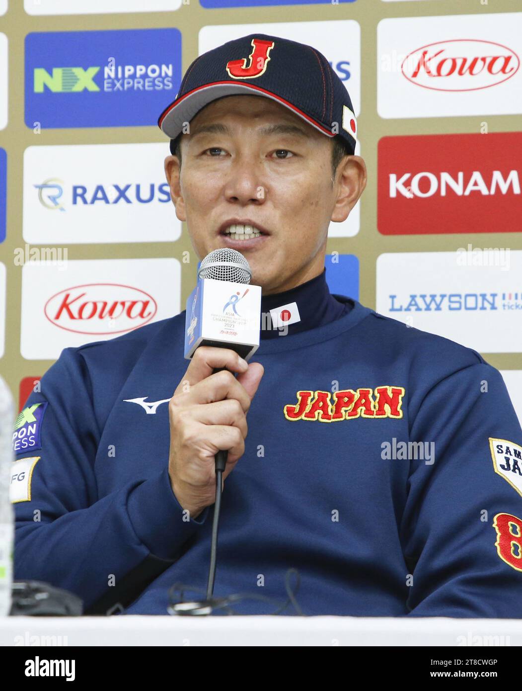 Japan manager Hirokazu Ibata speaks during a post-game press conference ...