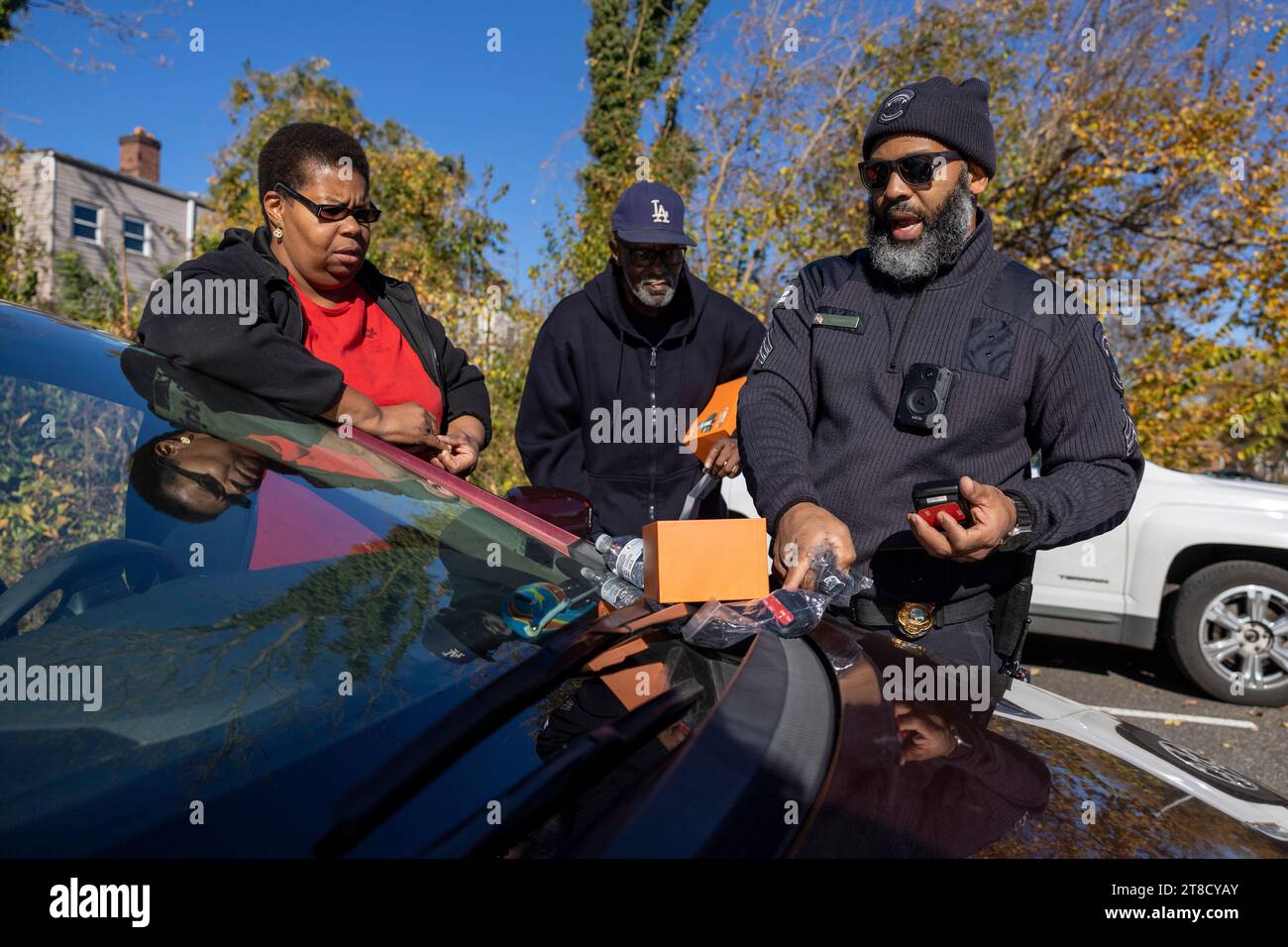 Sgt. Jason Godfrey explains to Grace Jdemba, a delivery driver, and ...
