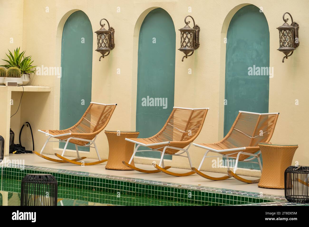 Swimming pool with beach chairs Stock Photo - Alamy