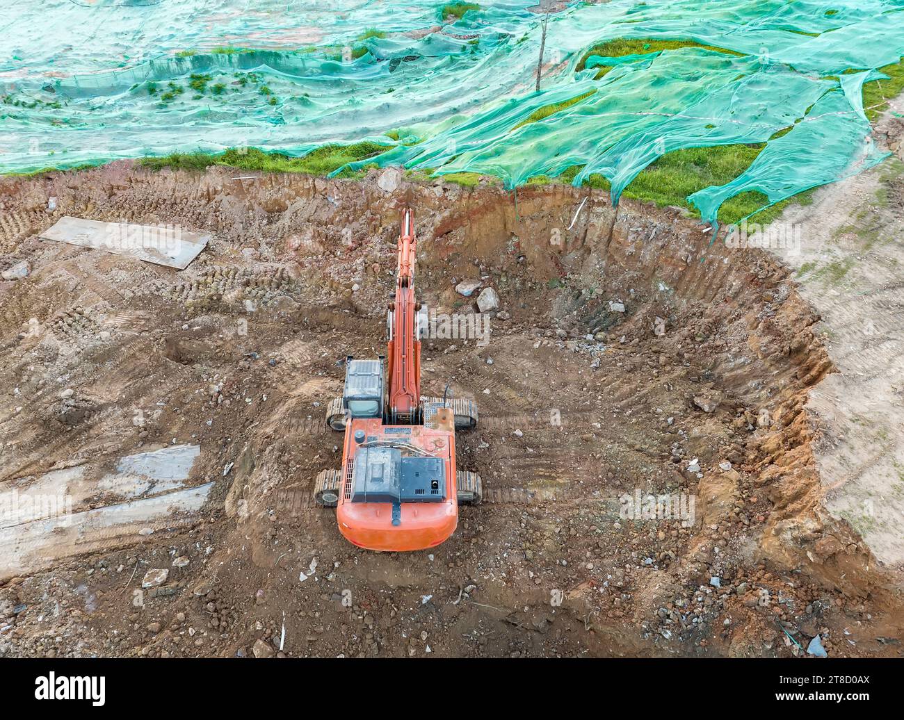 Excavator on earthmoving at construction site, aerial view Stock Photo ...