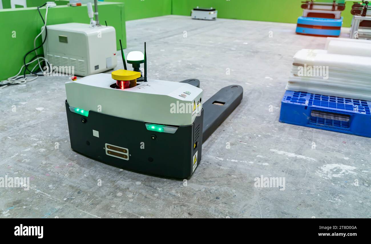 warehouse robot car carries cardboard box assembly in factory Stock ...