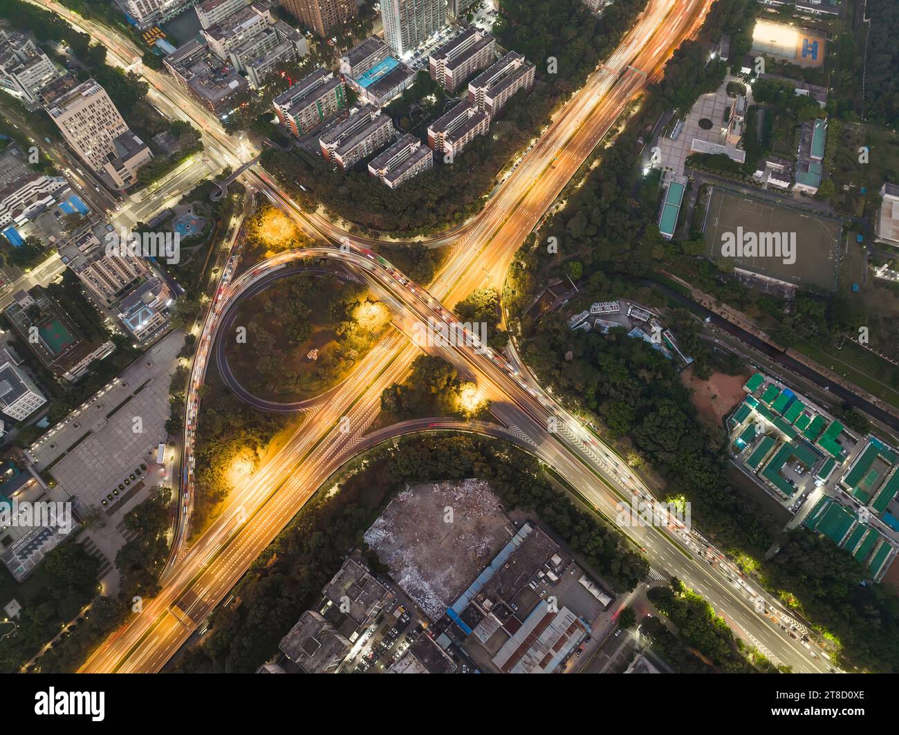 Busy highway road junction in metropolis city center at night ...