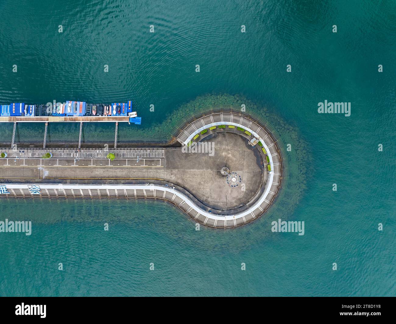 Aerial view breakwater at sea, pier, groyne, dock with boats and sea in ...