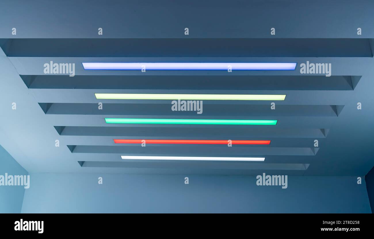 colorful LED decorative strip under the ceiling of a modern corridor ...