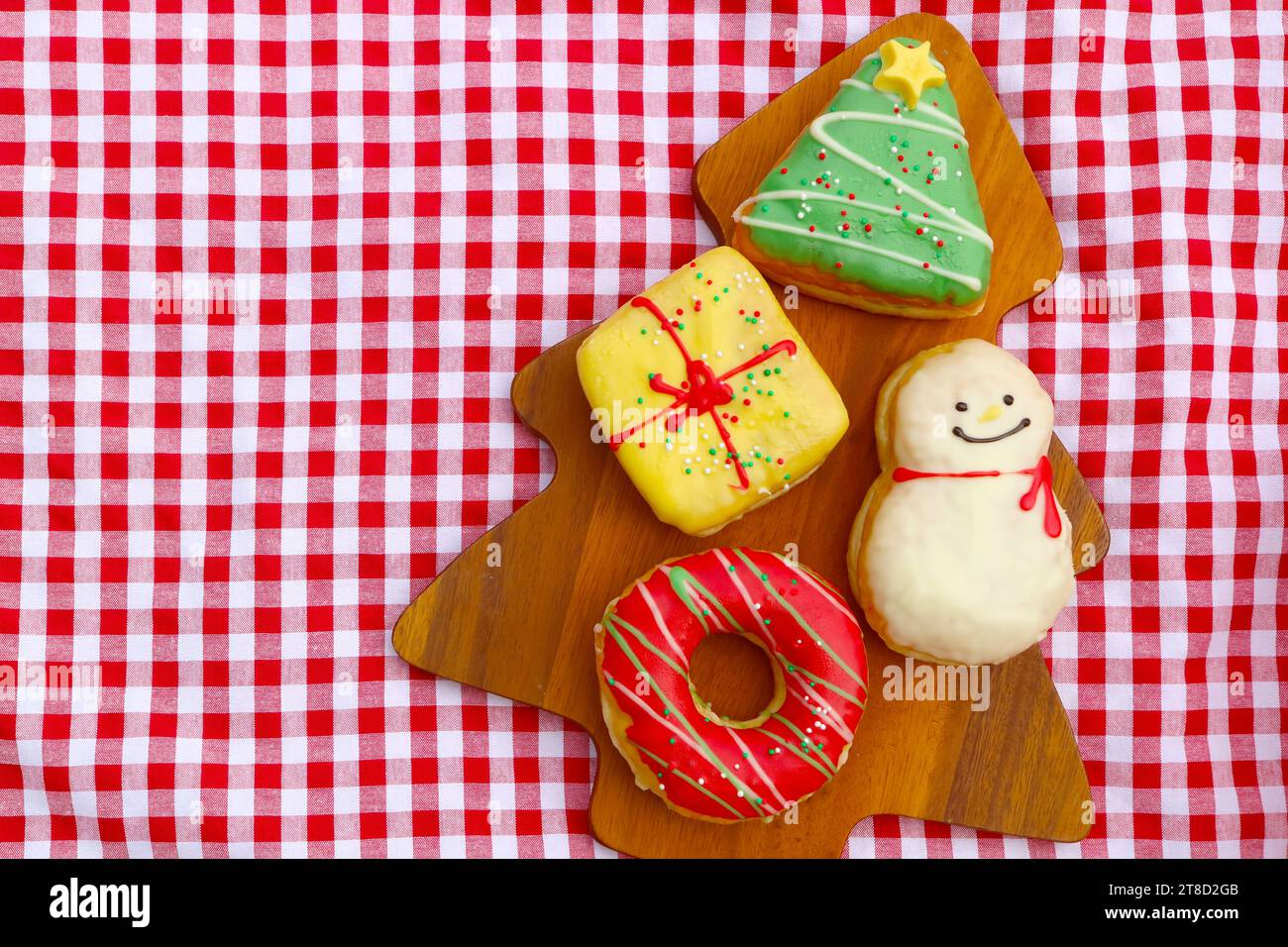 Vivid Colored Assorted Christmas Theme Doughnuts on Pine Tree Shaped ...
