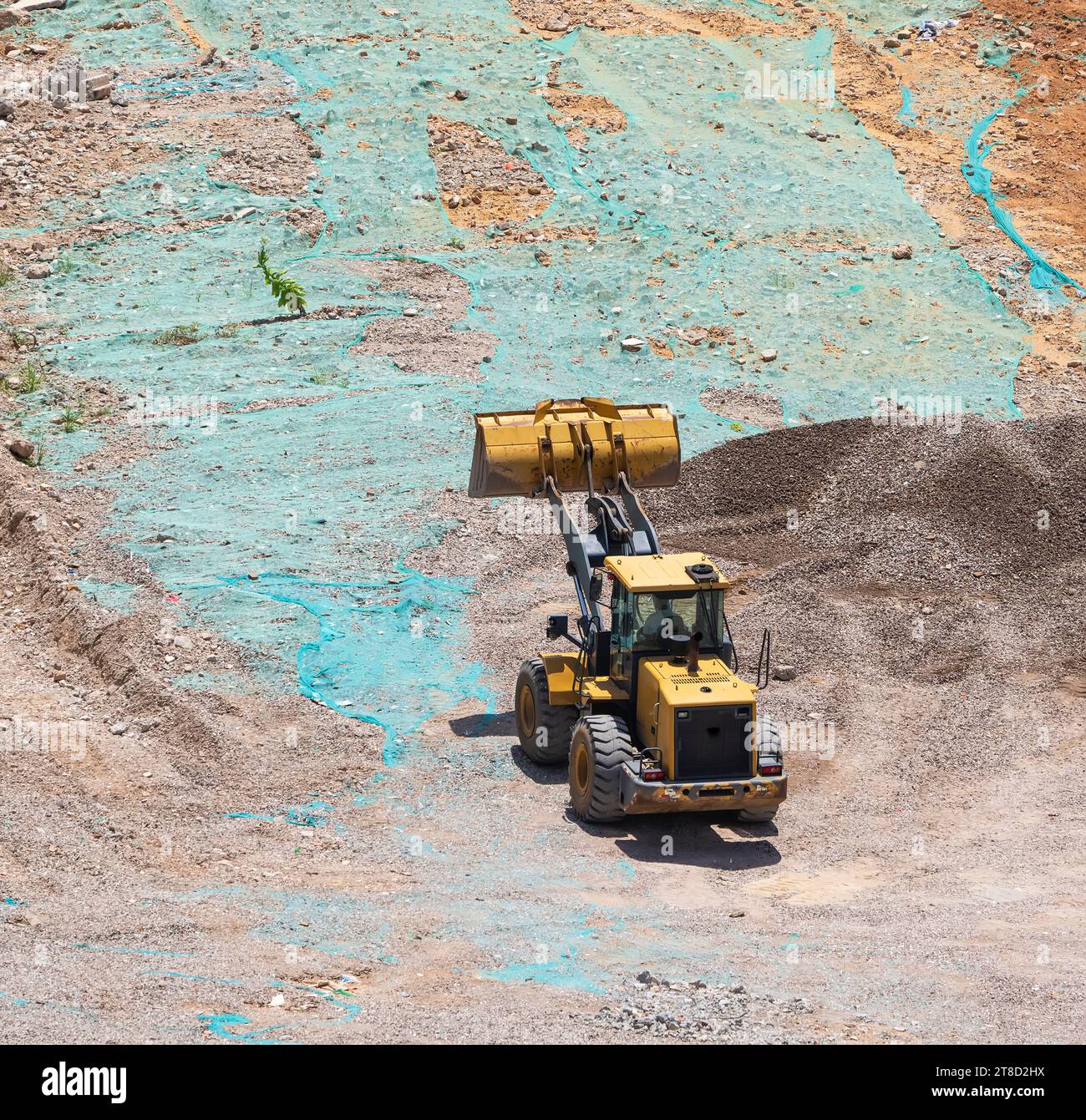 excavator loader machine during earthmoving works outdoors Stock Photo ...