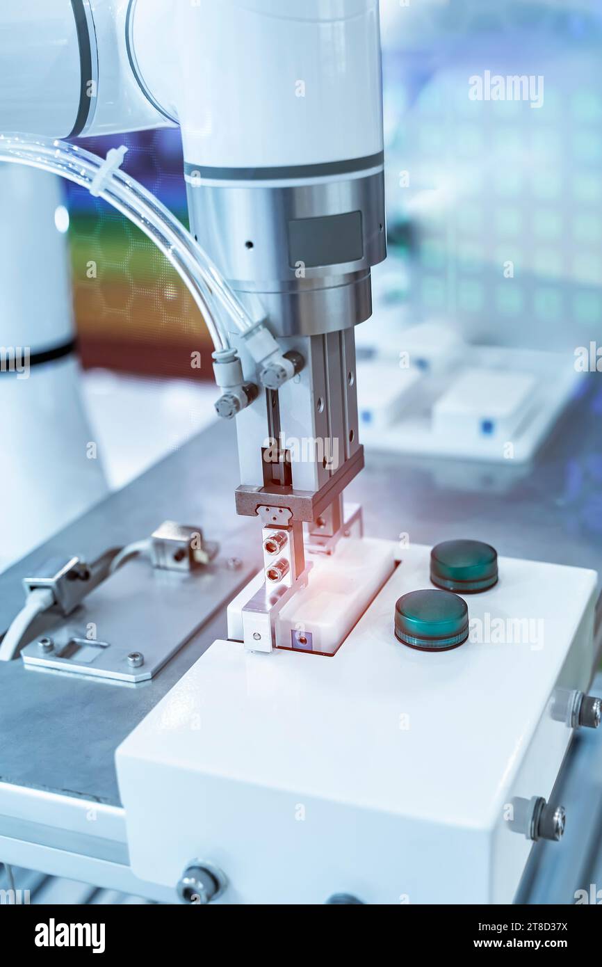 robotic arm catch for electronic assembly line. The robot for smart ...