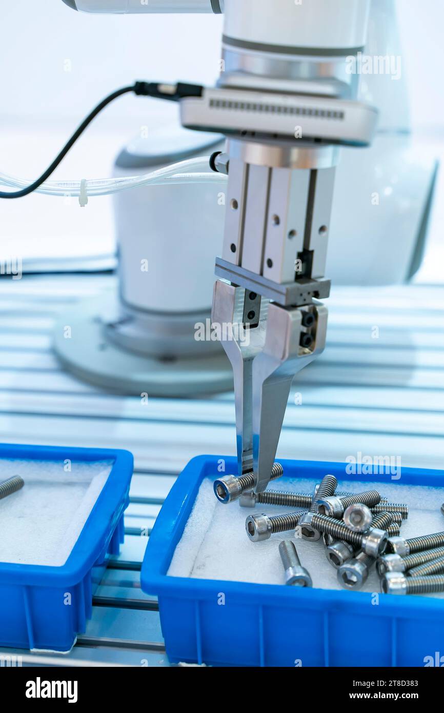 automatic robot arm catch for screw assembly line. The robot for hi ...